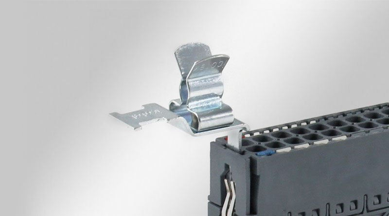 EMC shield clamps for bus modules with plug-in mounting function